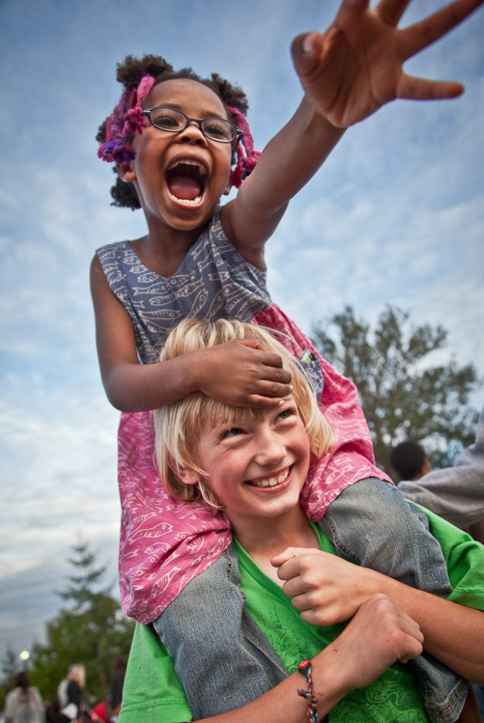 Little girls with one on the others shoulders - Alaska State Fair
