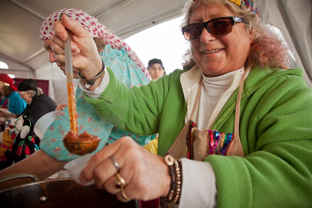 Woman pouring some chilli